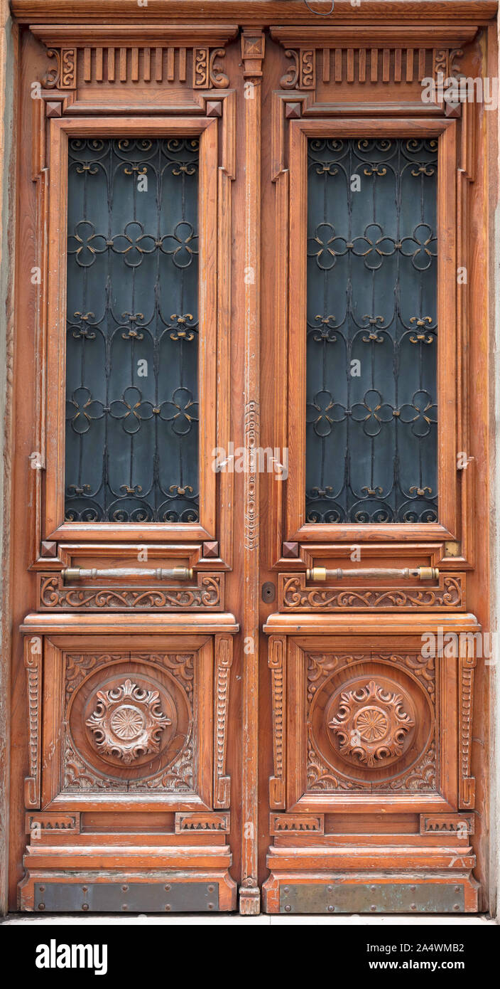 Old wooden door with carved ornaments. Frontal view Stock Photo - Alamy
