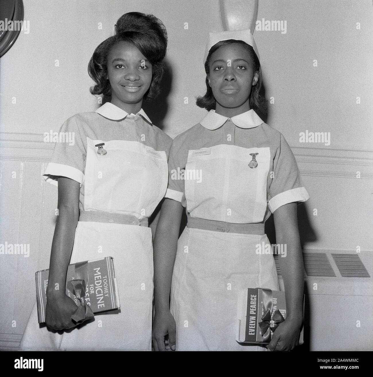 1967, historical, two newly qualified foreign nurses stand together for ...