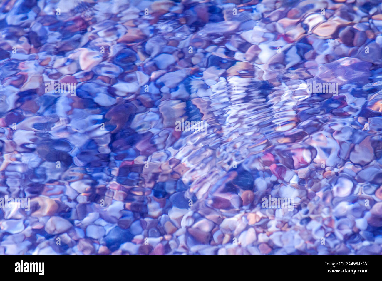 sea pebbles colored granite on the beach background stones. The shore ...