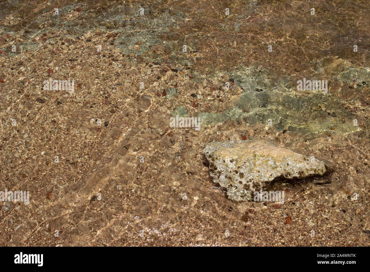 Summer background of hot sand with sea or ocean wave bubbles with copy ...