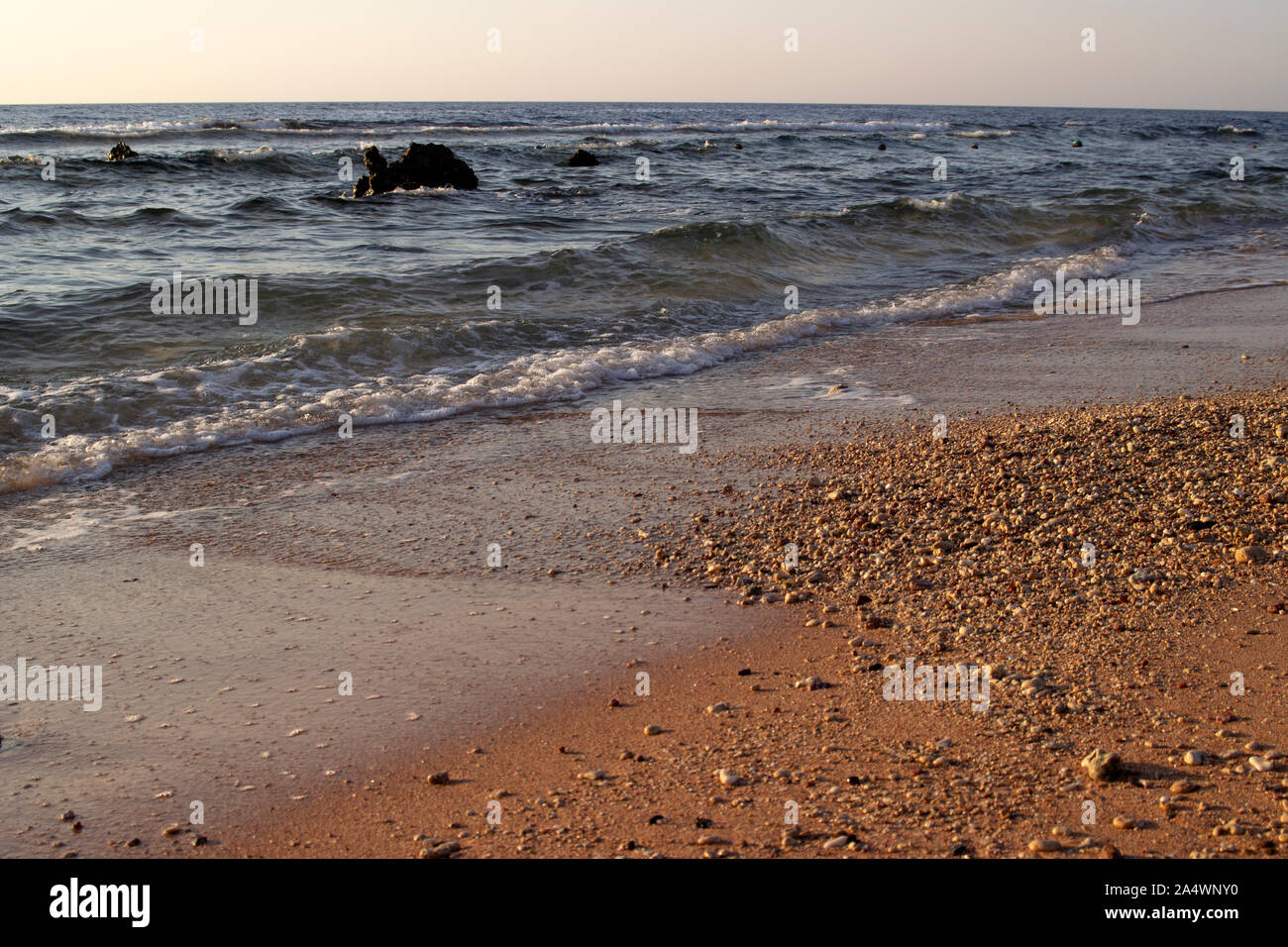 Summer background of hot sand with sea or ocean wave bubbles with copy ...