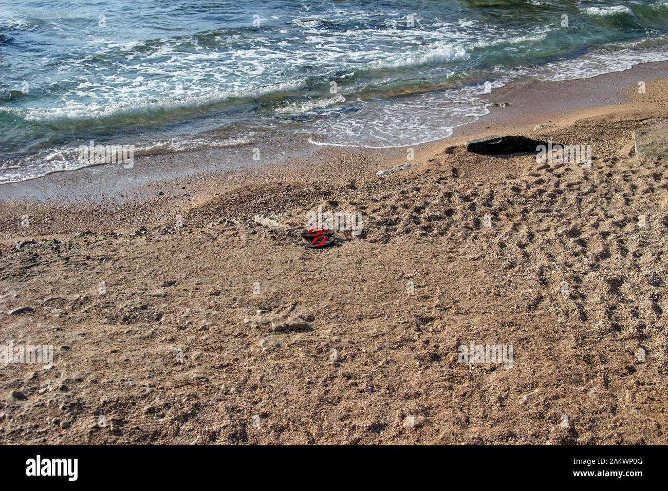 Summer background of hot sand with sea or ocean wave bubbles with copy ...