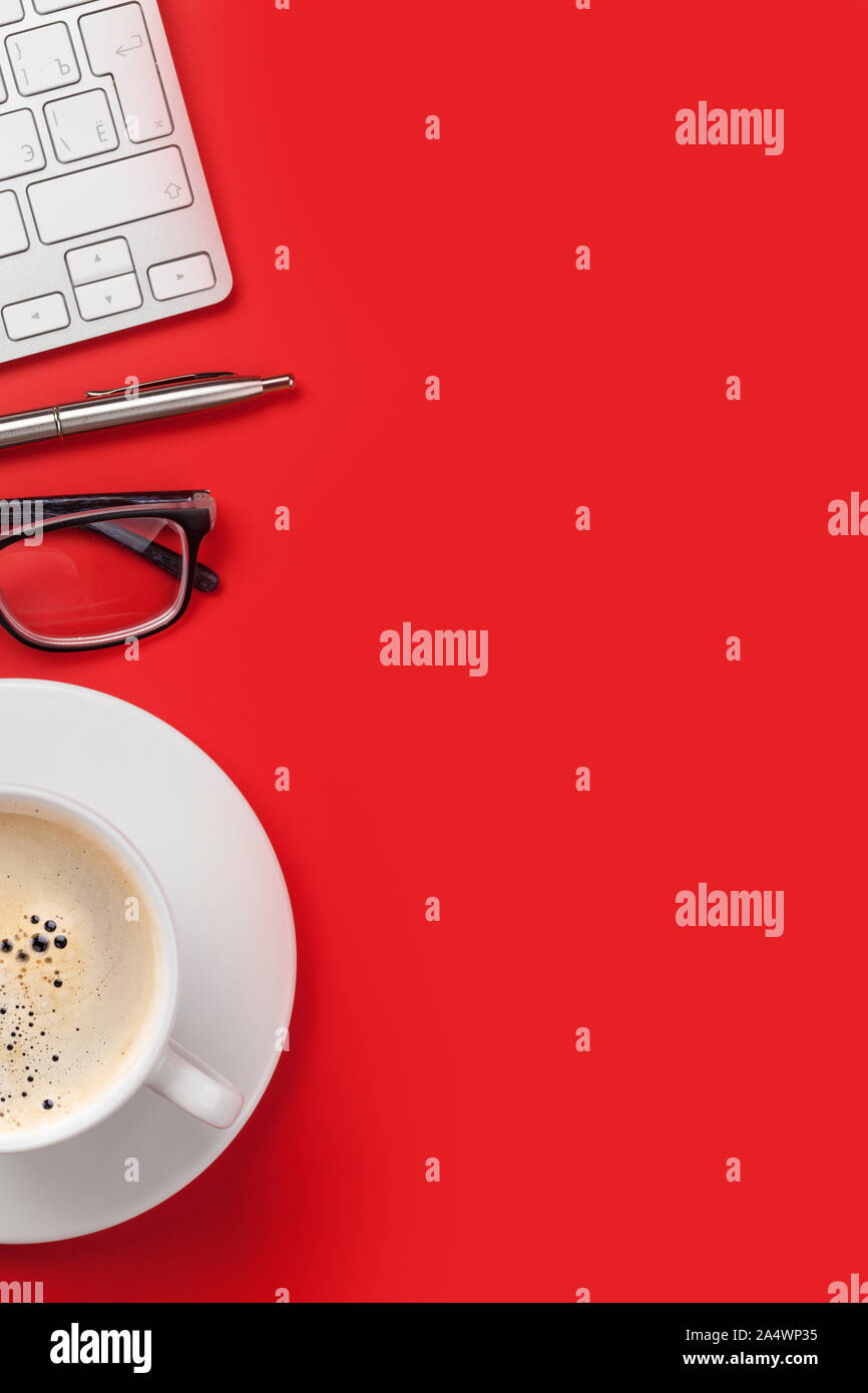 Office red workplace backdrop with coffee cup, supplies and computer ...