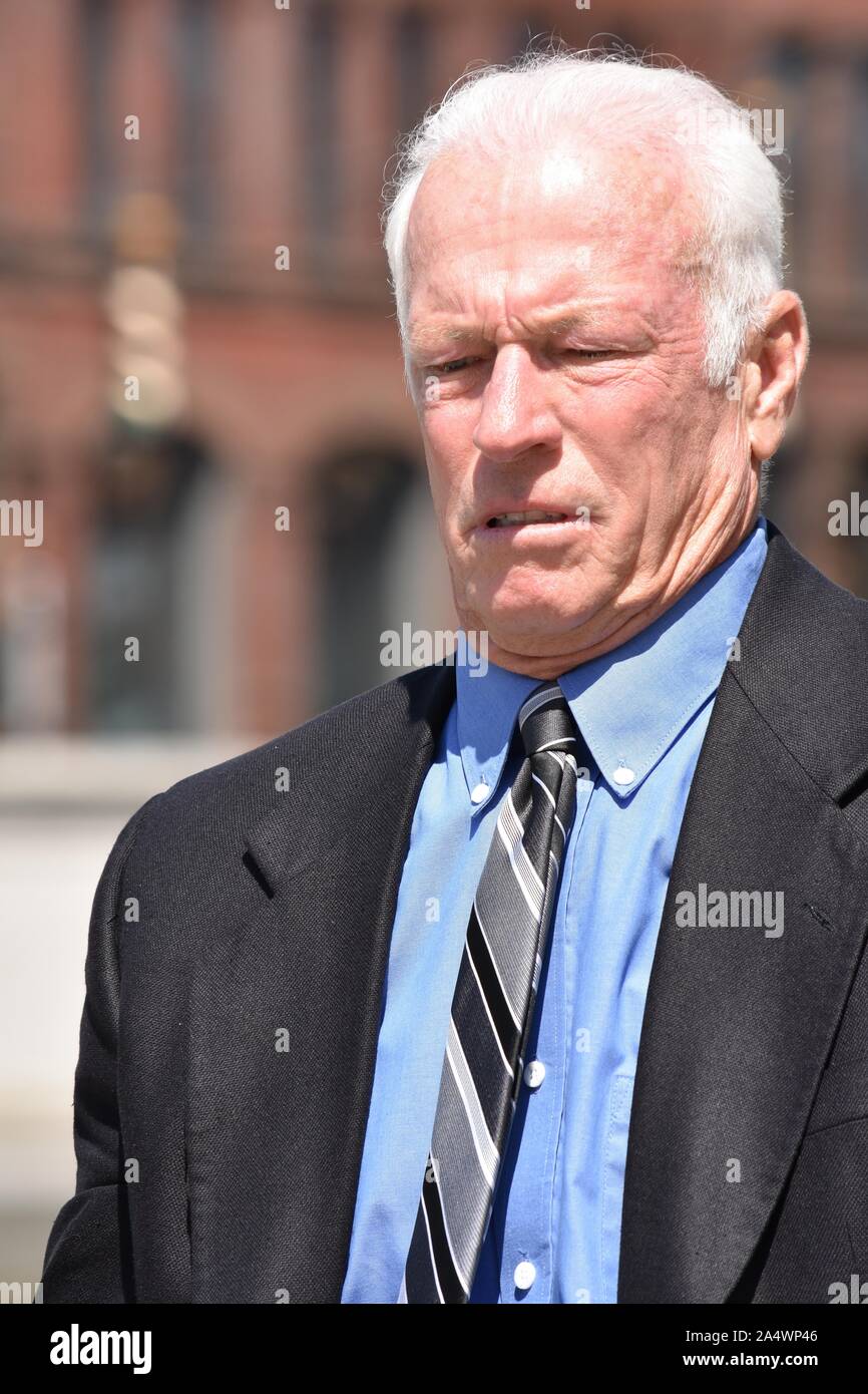 Confused Senior Business Man Stock Photo - Alamy