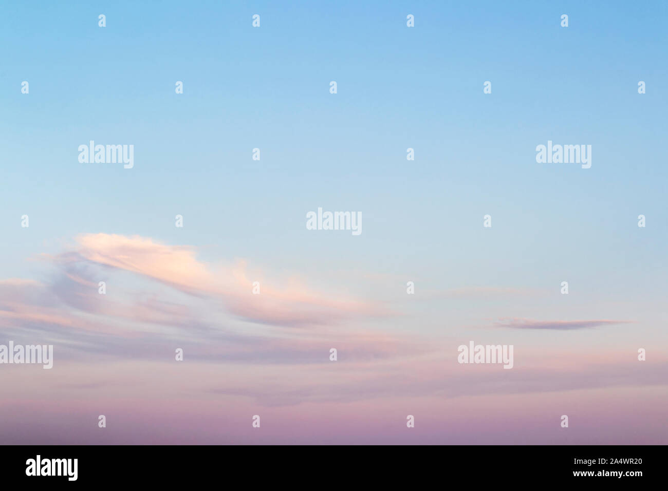 Sweet sky. Pink clouds in a blue sky at evening. Sky and clouds ...