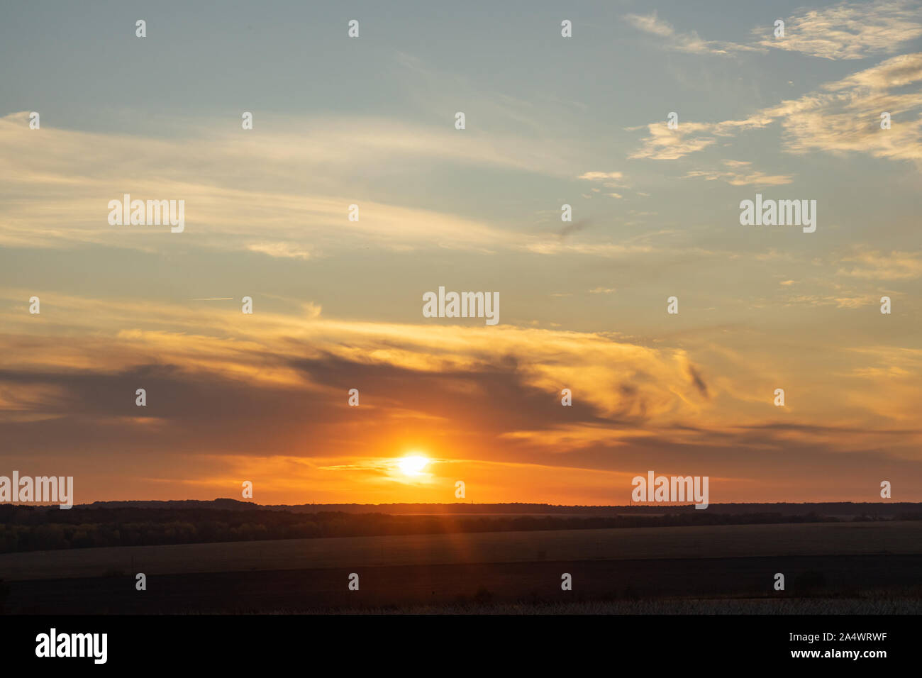 Beautiful orange sunset and field. Endless open spaces Stock Photo - Alamy