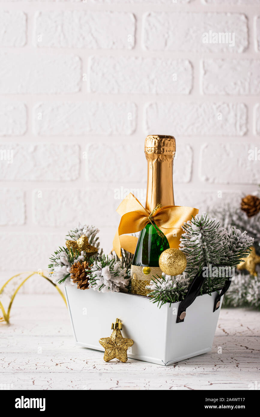 Bottle of champagne in a gold wrapper Stock Photo - Alamy