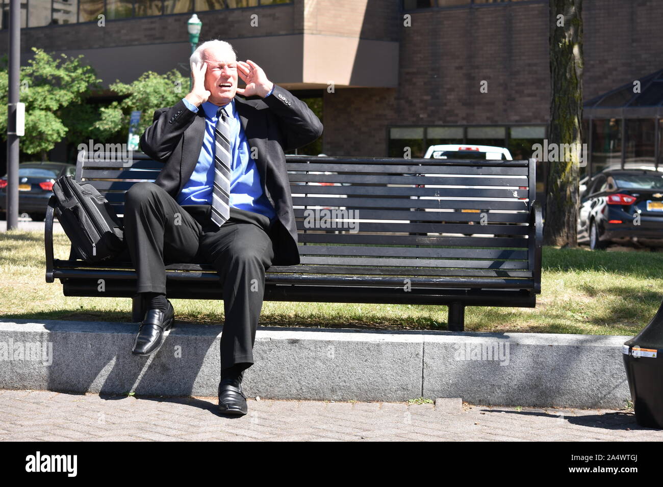 Men seated on benches hi-res stock photography and images - Alamy