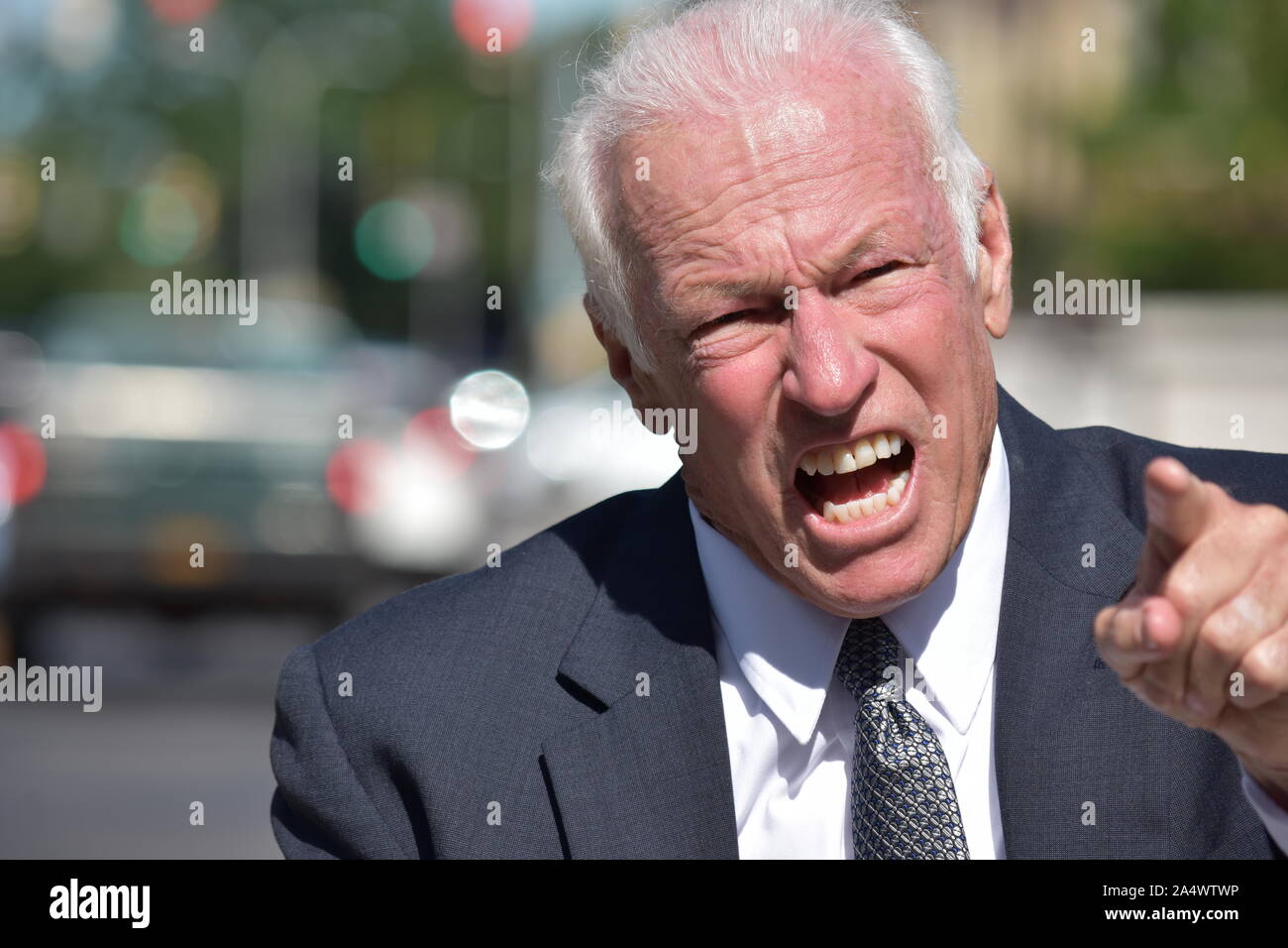 Business Man And Anger Wearing Suit And Tie Downtown Stock Photo - Alamy