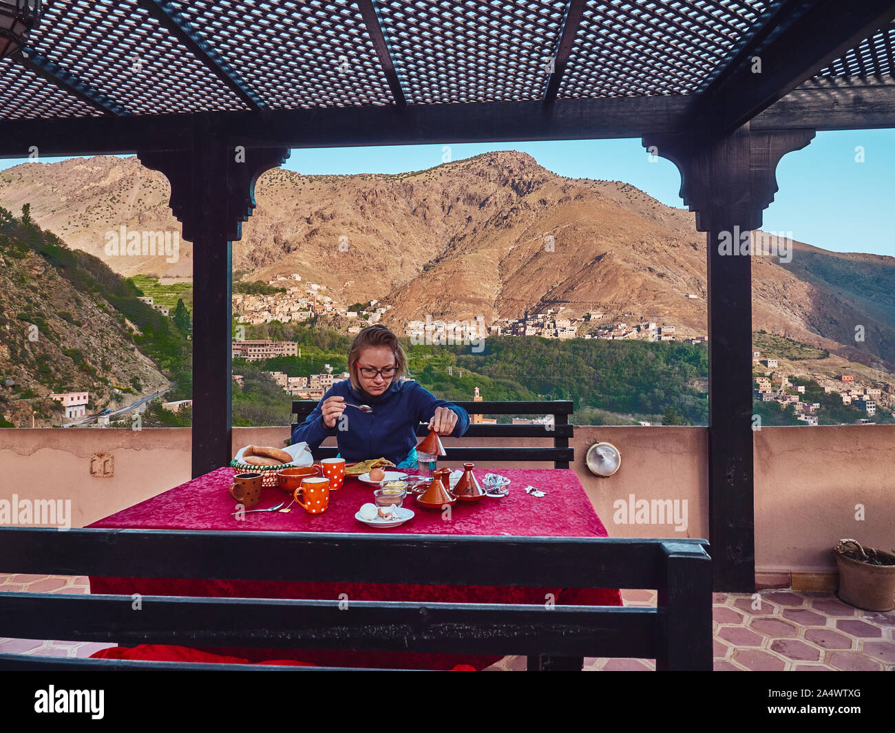 Caucasian blonde girl hlaving typical moroccan breakfast with amlu and ...