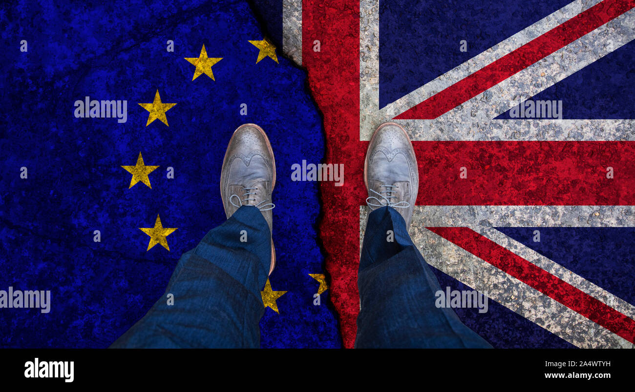 Business man standing on cracked flags of UK and european union. Brexit ...