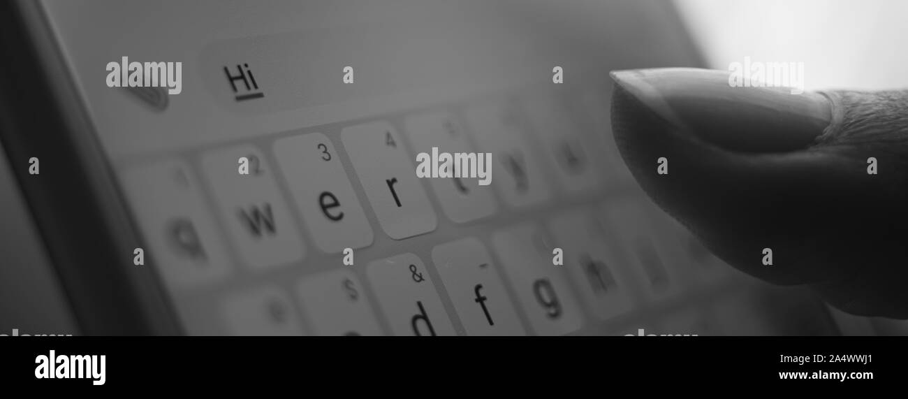 Human hand typing on a white smartphone a message Hi Stock Photo - Alamy