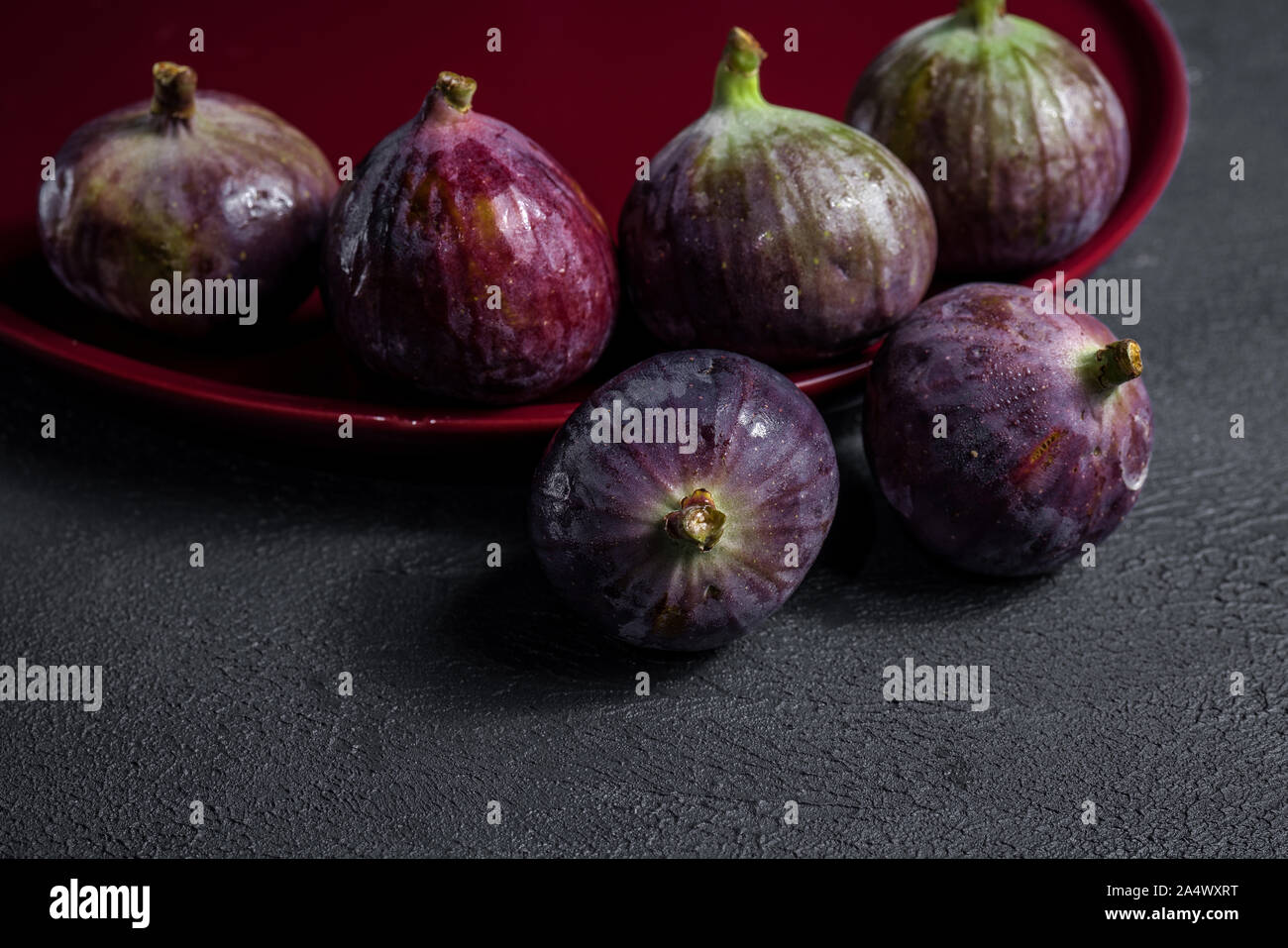 fresh figs close-up photo on black background. dark moody photo Stock ...