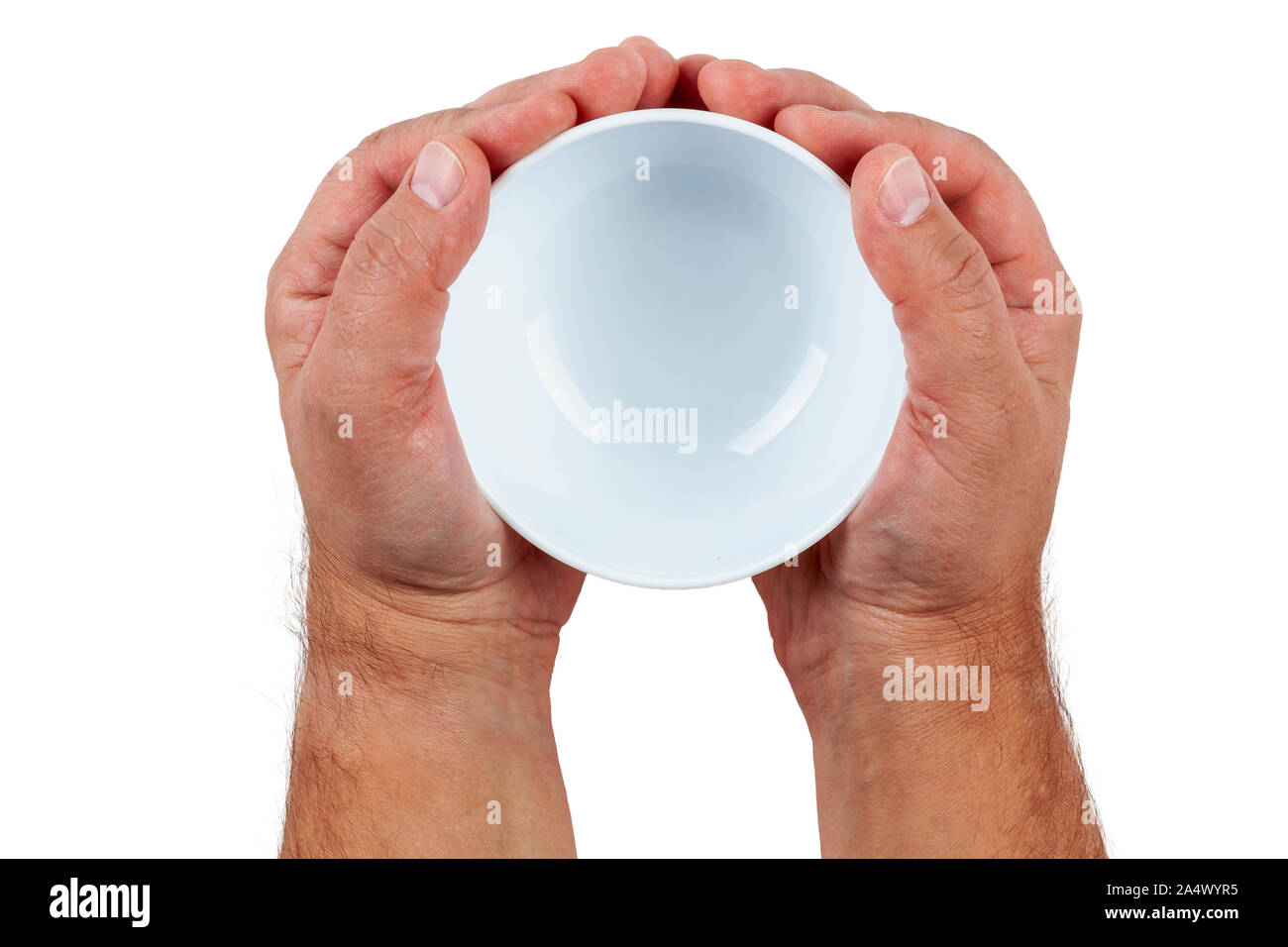 Two hands hold a small plate on a white background. Close up isolate ...