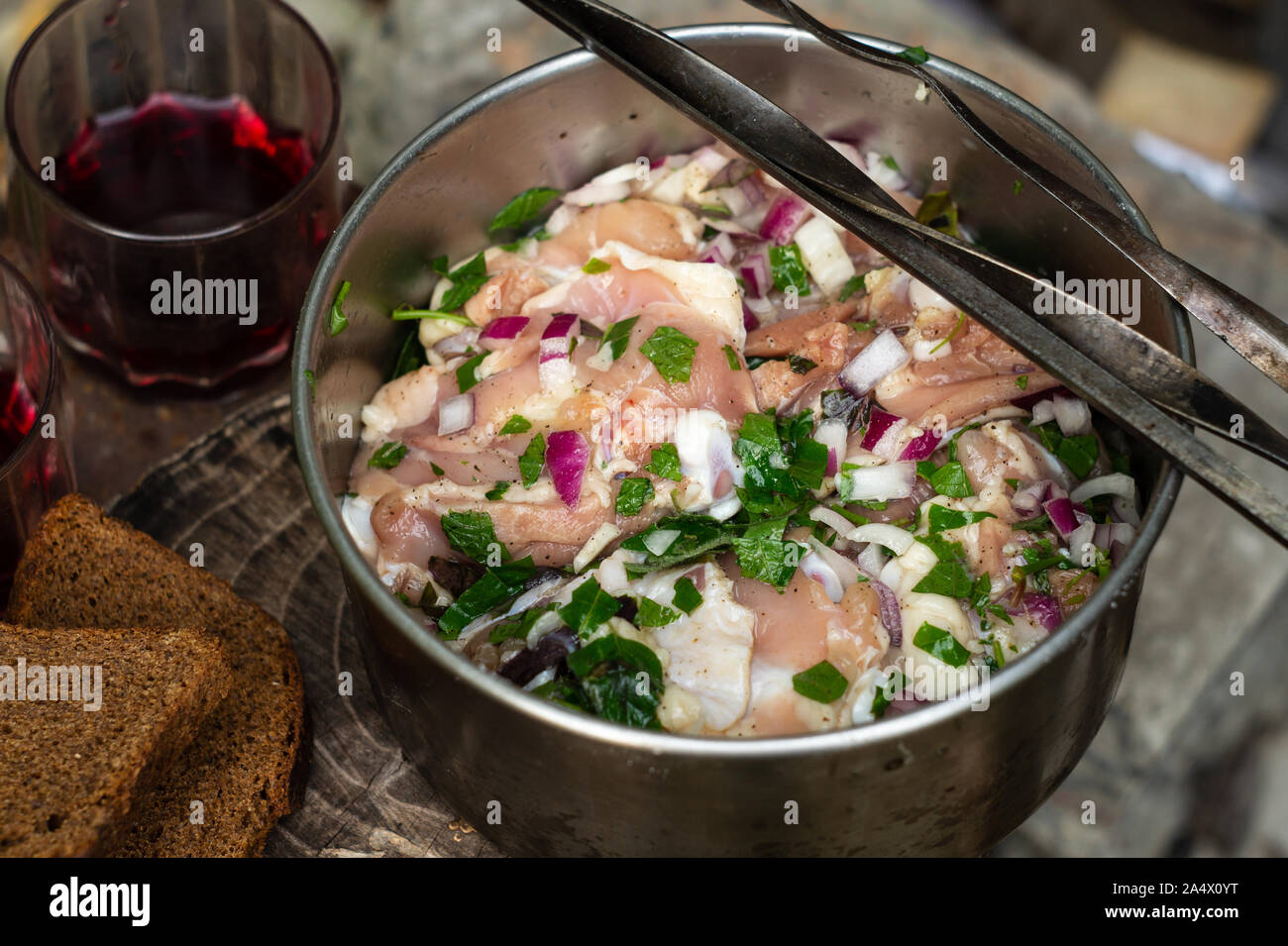 Chicken marinated with herbs and spices for cooking grilled Stock Photo ...