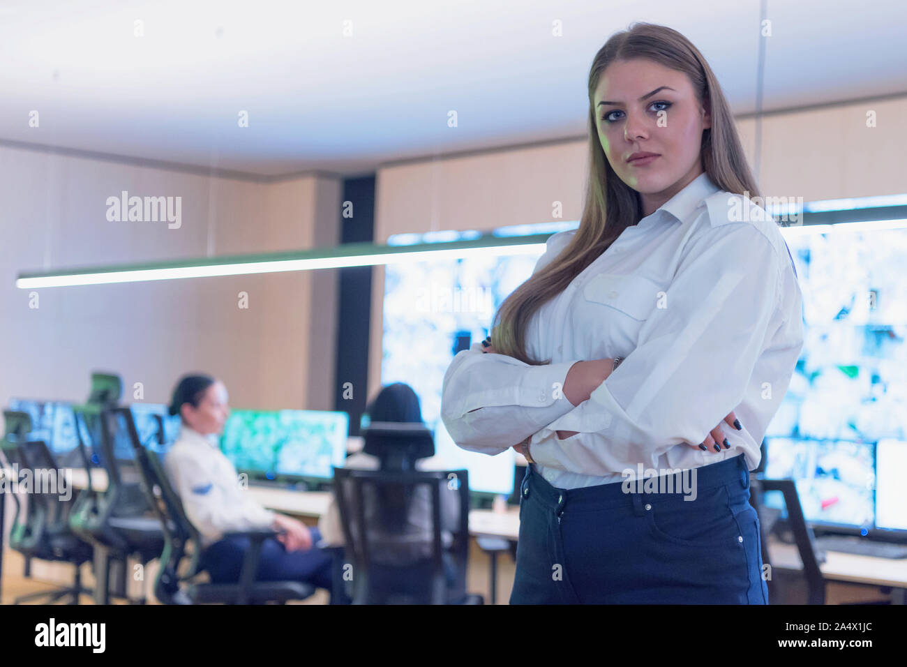 Security guard monitoring modern CCTV cameras in surveillance room ...