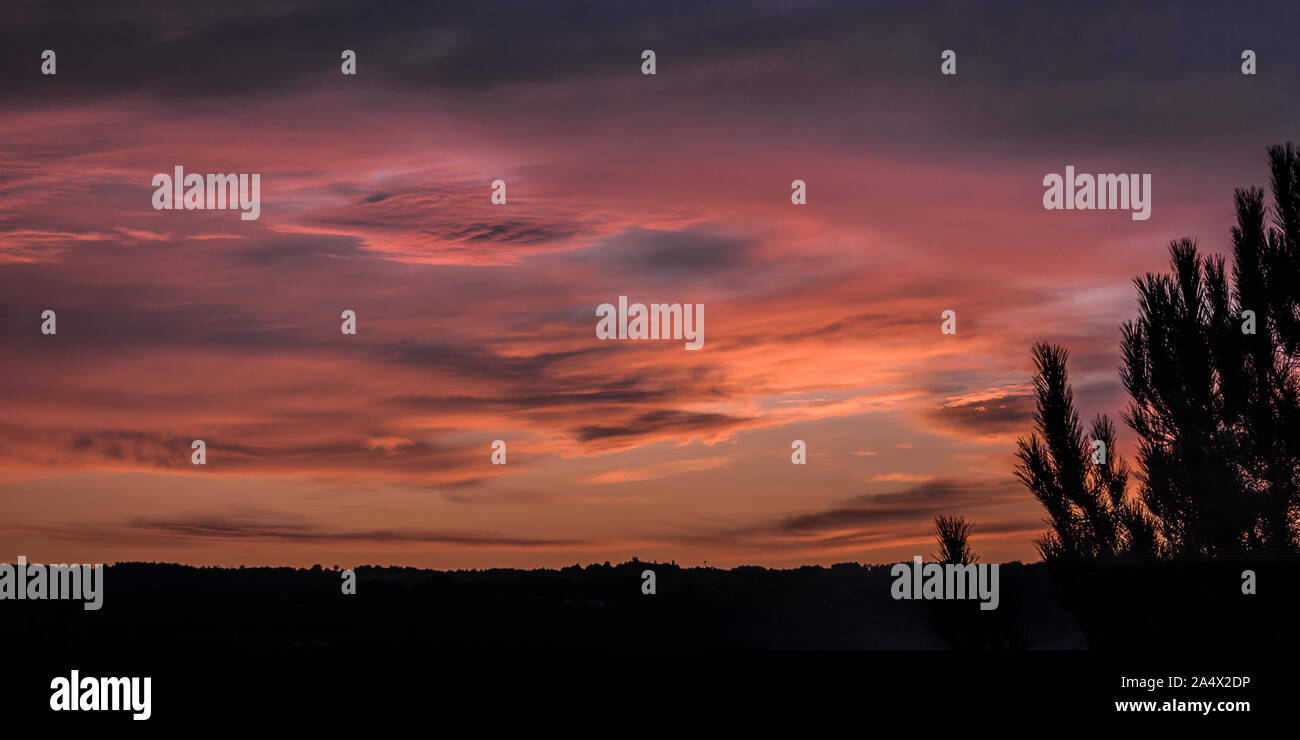 Sunset panorama in red and blue colors Stock Photo - Alamy