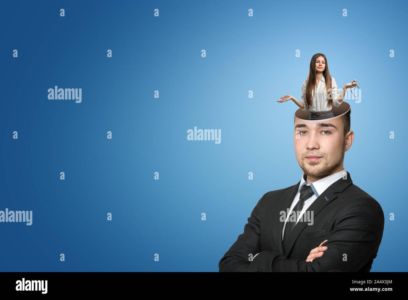 Businessman, arms folded, with upper part of head missing as if it had ...