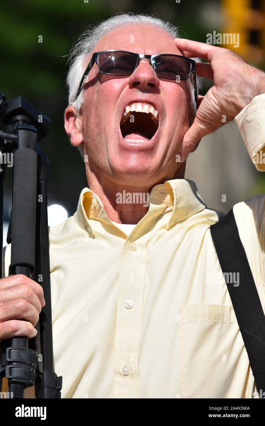 Stressed Adult Photographer Wearing Sunglasses With Tripod Stock Photo ...