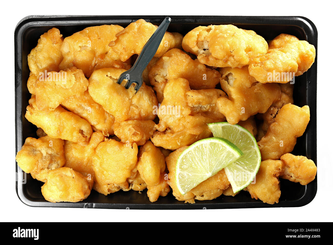 Kibbeling in a plastic tray isolated on white background. Kibbeling is ...