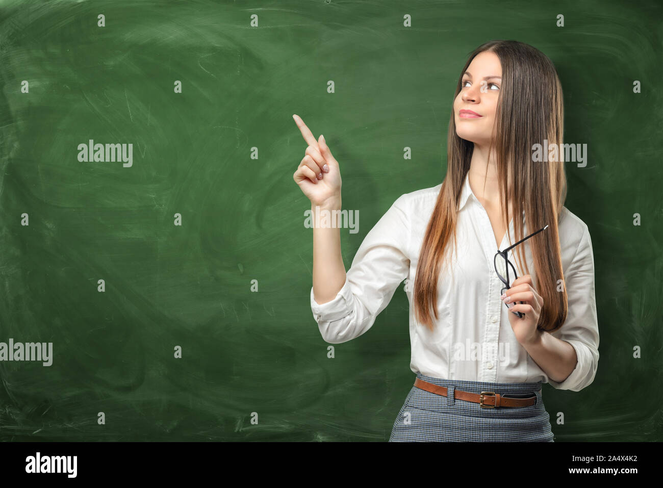 Teacher pointing board classroom hi-res stock photography and images ...