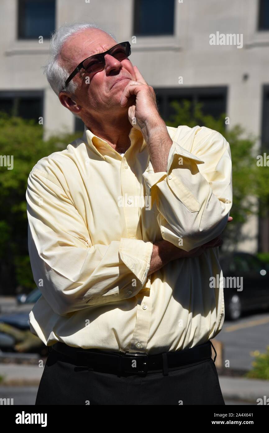 An Old Grandfather Decision Making Stock Photo - Alamy