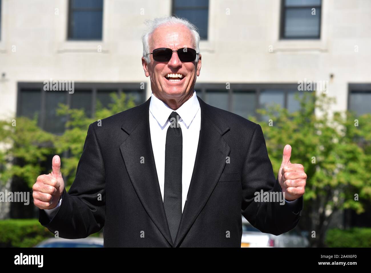 Male Politician With Thumbs Up Stock Photo - Alamy