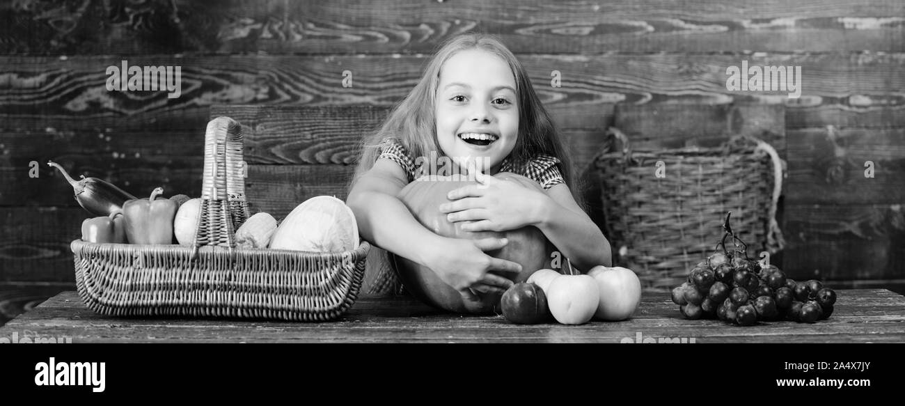 Girl kid at farm market with organic vegetables. Grow your own organic ...