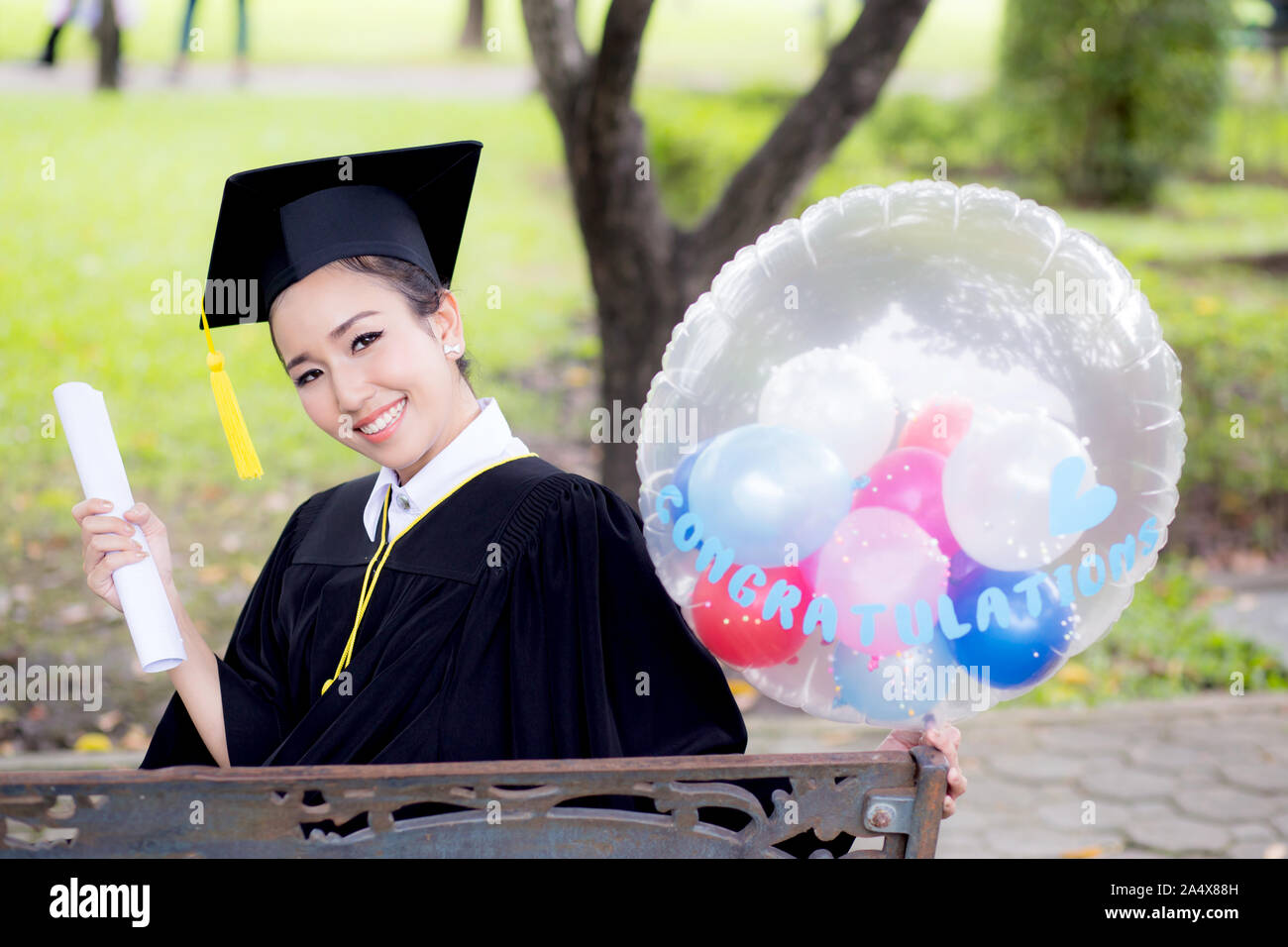 Portrait college student in convocation hi-res stock photography and ...