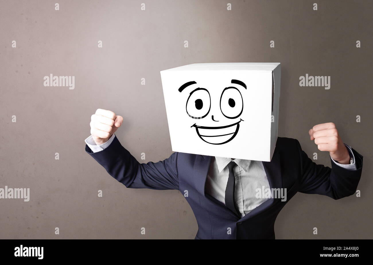 Young boy standing and gesturing with a cardboard box on his head Stock ...