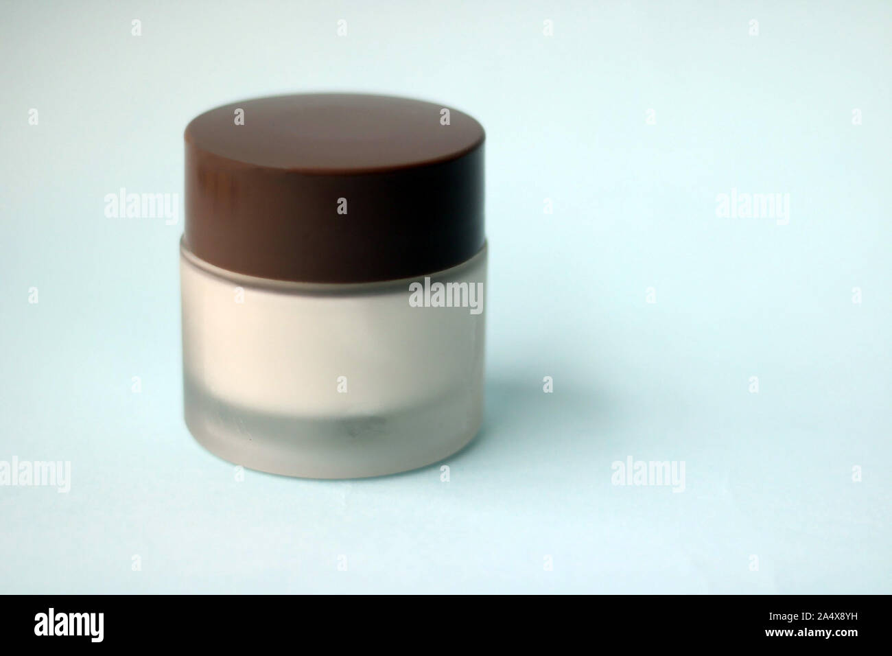 Isolated jar of moisturizer in blue background. Skin-care Concept Stock ...