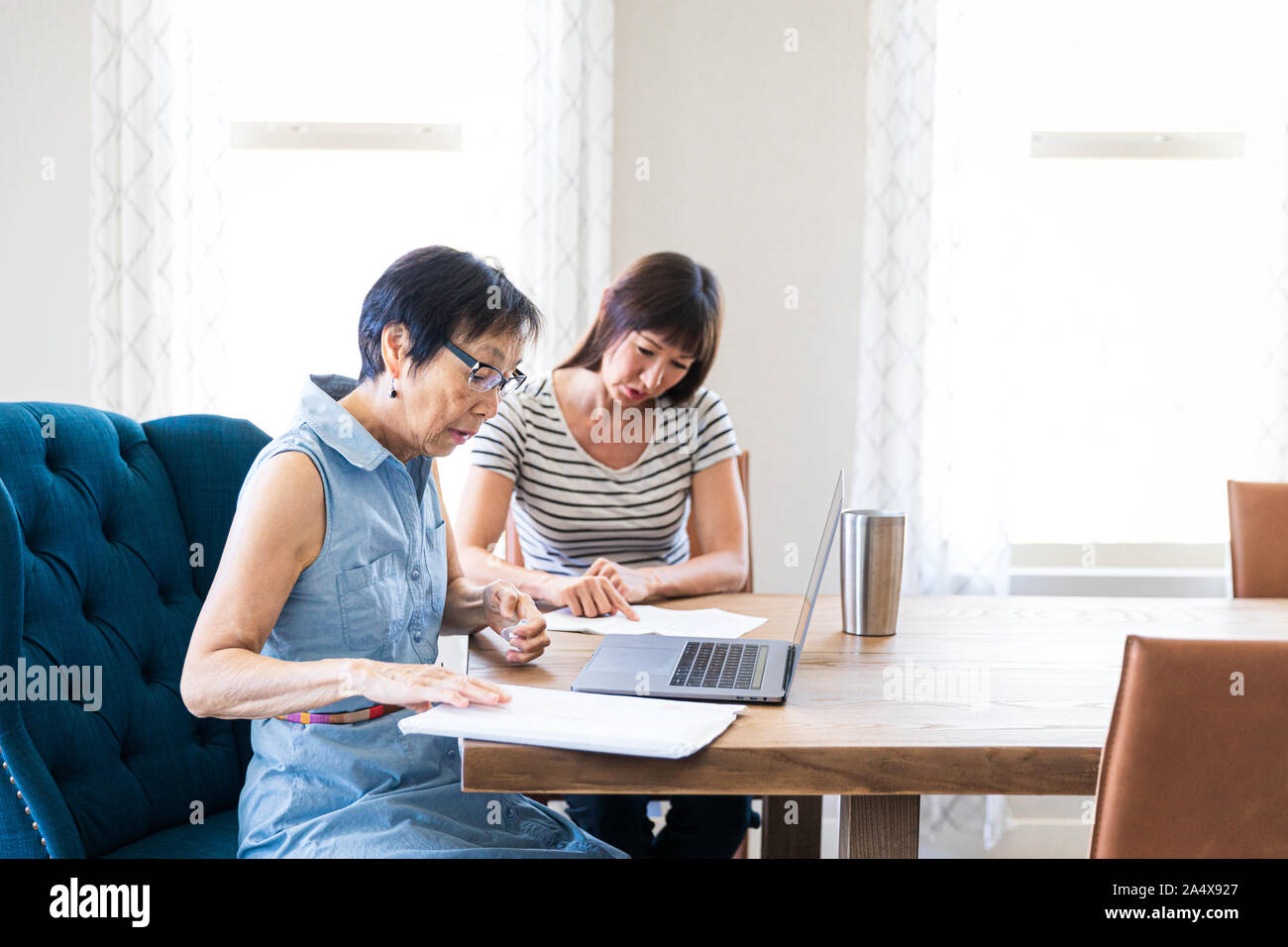 Parent and Child Doing Paperwork Together Stock Photo - Alamy