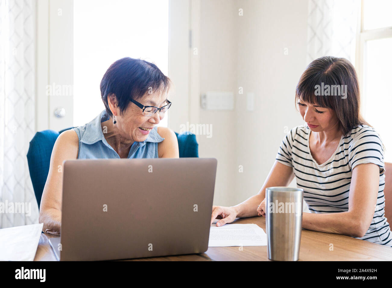 Daughter helping elderly mother hi-res stock photography and images - Alamy