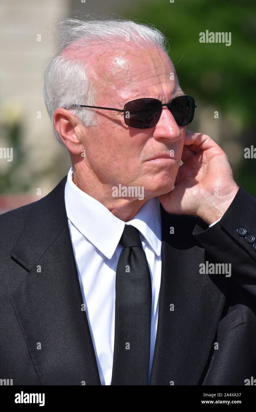 Handsome Senior Security Guard Hearing Wearing Sunglasses Stock Photo ...