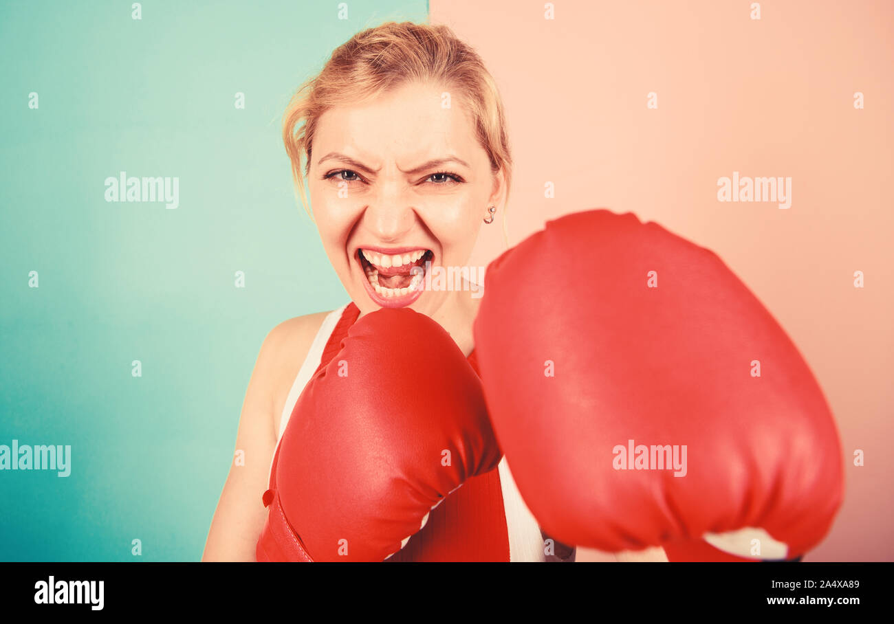 Boxing improve temper and will. Woman boxing gloves focused on attack ...