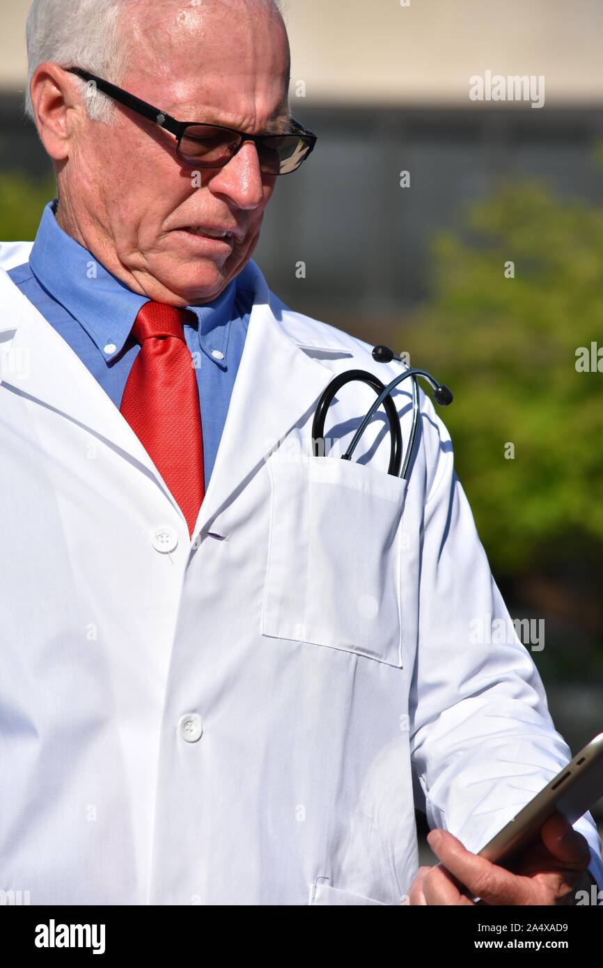 Stressed Male Doctor At Hospital Stock Photo - Alamy