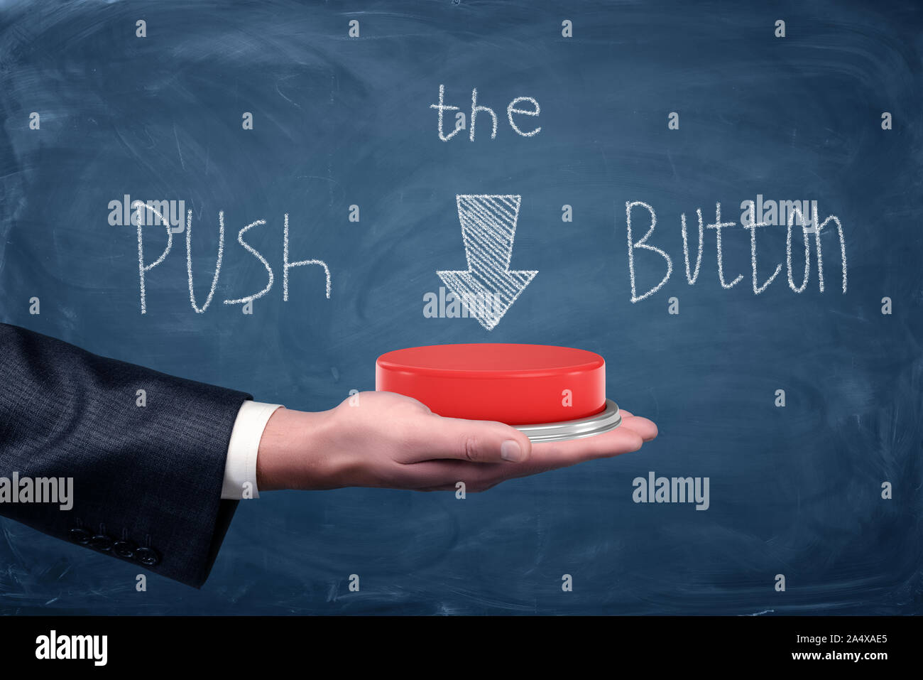 A large red push button resting on businessman's palm under a ...