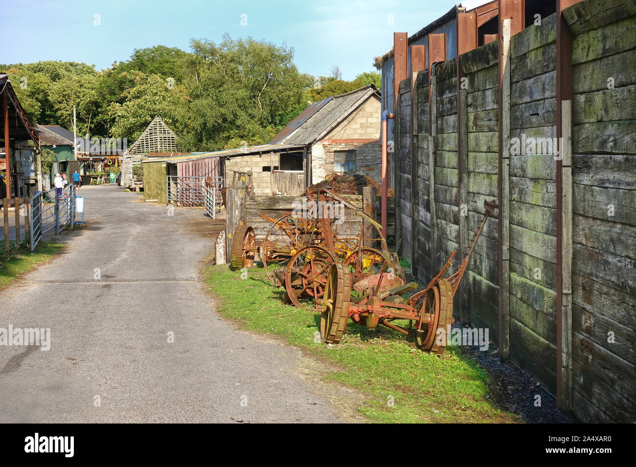 Traditional old farm, with rusty old agricultural equipment and ...