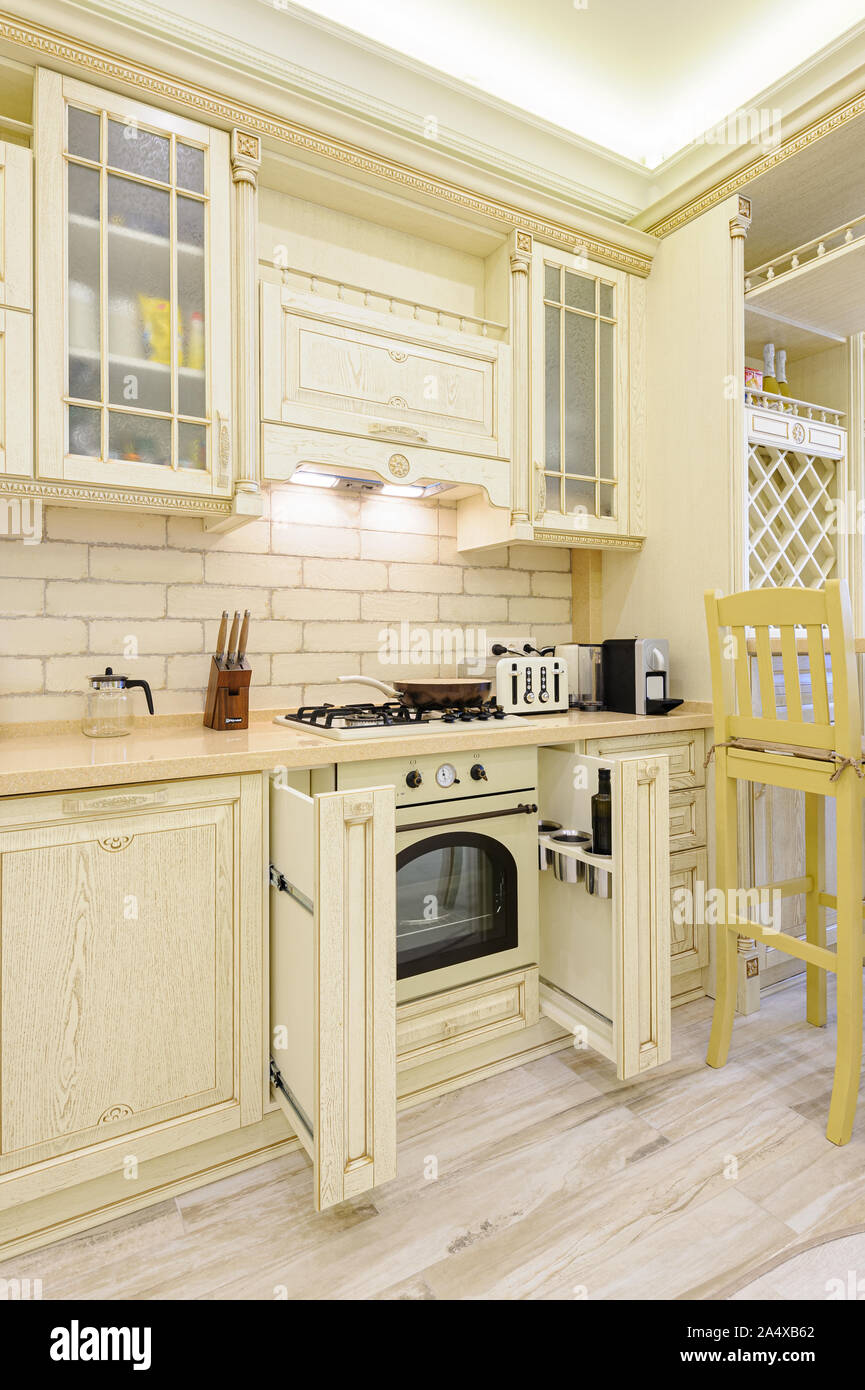 Luxury modern beige kitchen closeup, some drawers open Stock Photo - Alamy