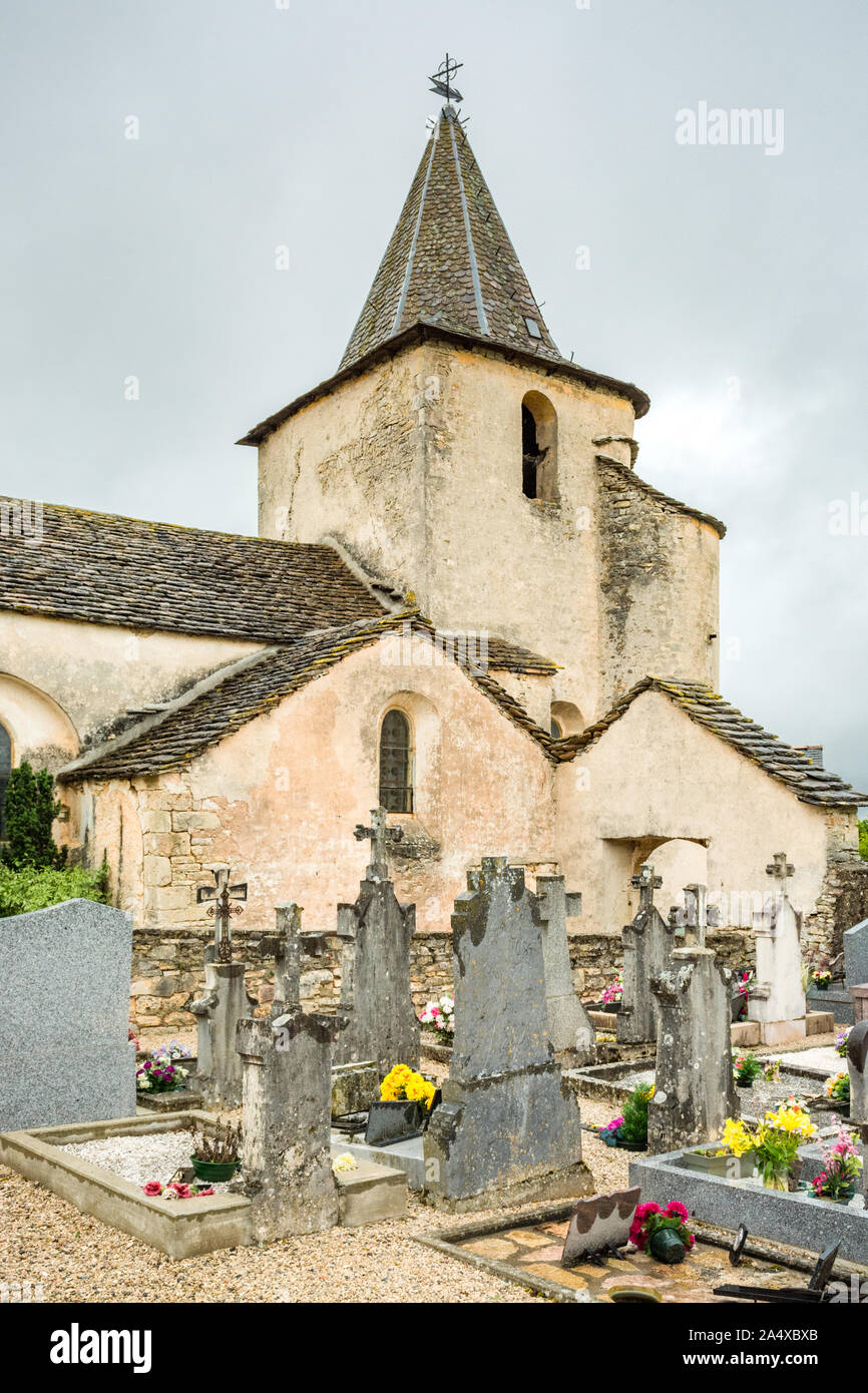 Cemetery at the foot of a small Romanesque church in Lozere, France ...