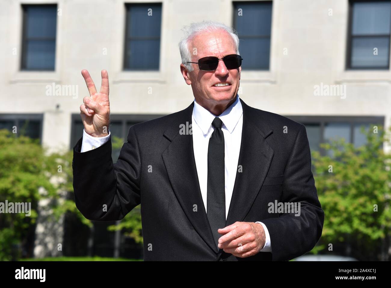 Male Politician And Victory Wearing Business Suit Stock Photo - Alamy