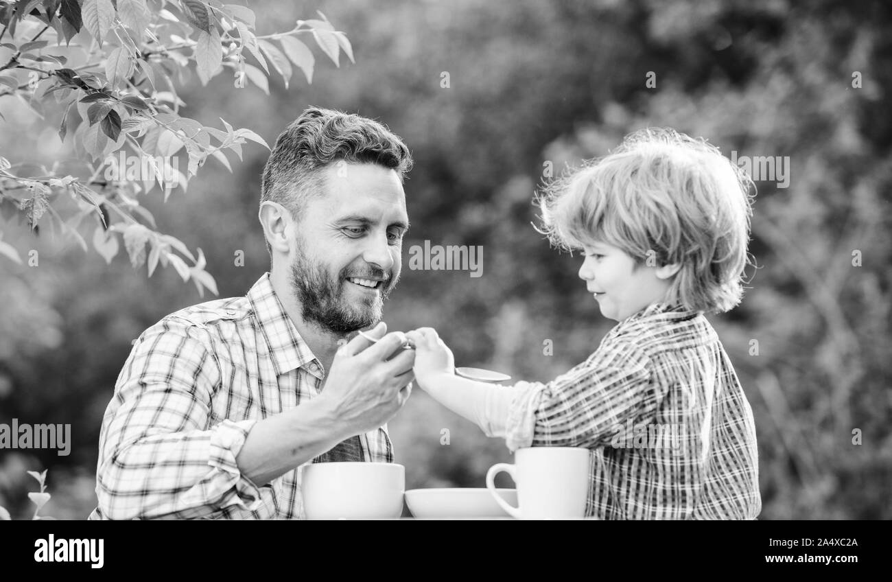 Super father. organic and natural food. small boy child with dad ...