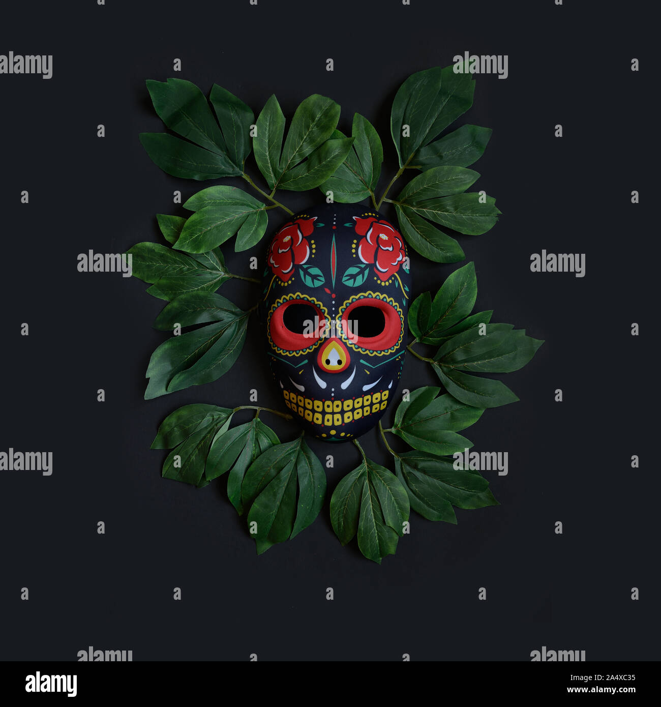 Sugar skull mask with flowers used for celebrating Day of the Dead in ...