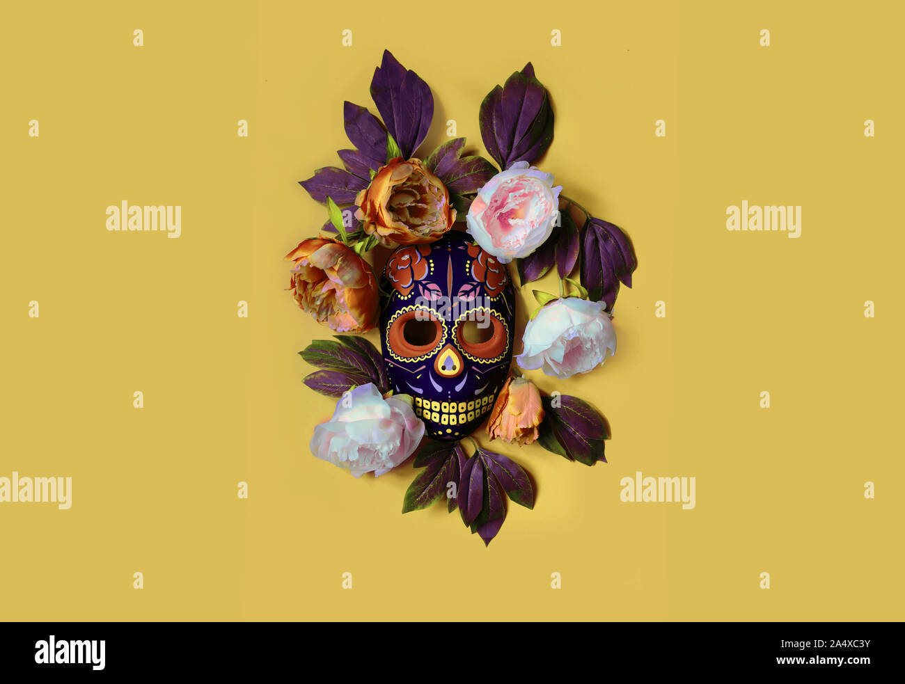Sugar skull mask with flowers used for celebrating Day of the Dead in ...