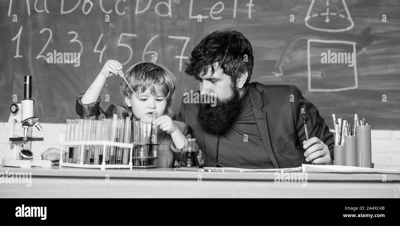 biotechnology research concept. small boy with teacher man. son and ...