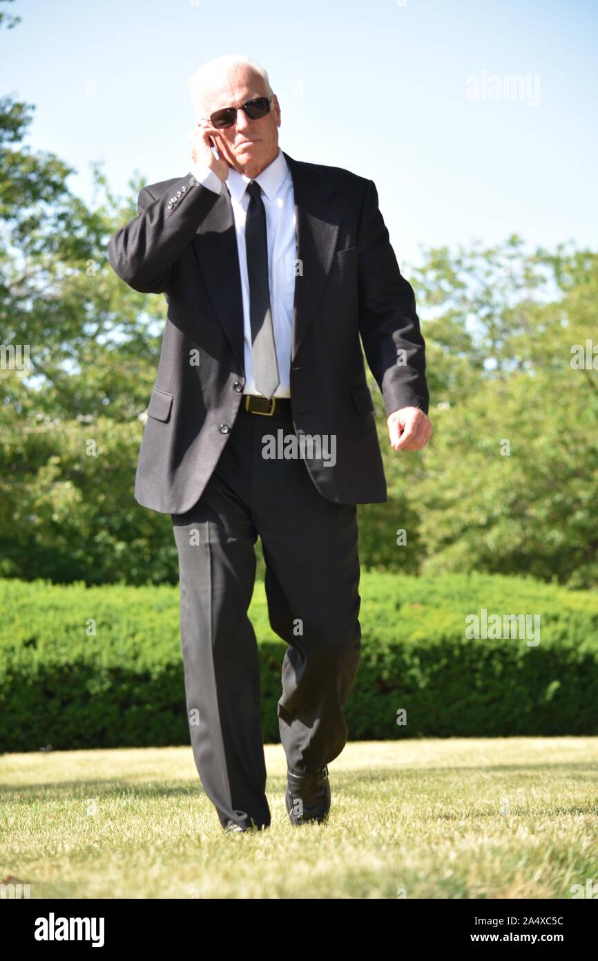 Listening Handsome Security Guard Walking Stock Photo - Alamy