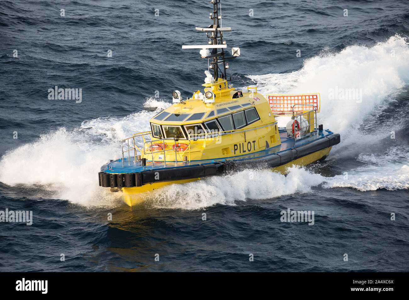 Blue and yellow coloured Pilot Boat on the Atlantic Ocean near Halifax ...