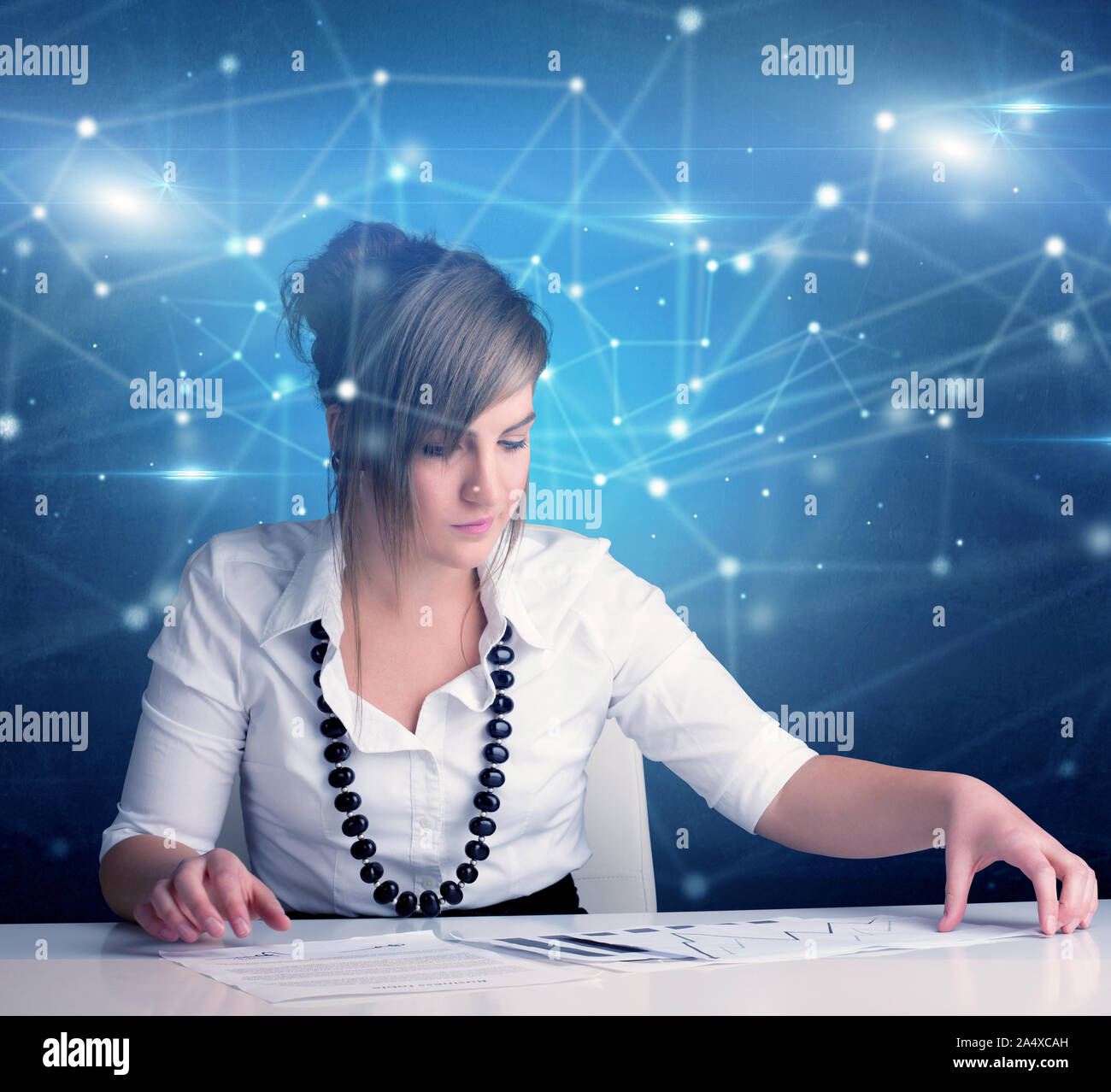 Manager in front of the office desk with networking concept Stock Photo ...