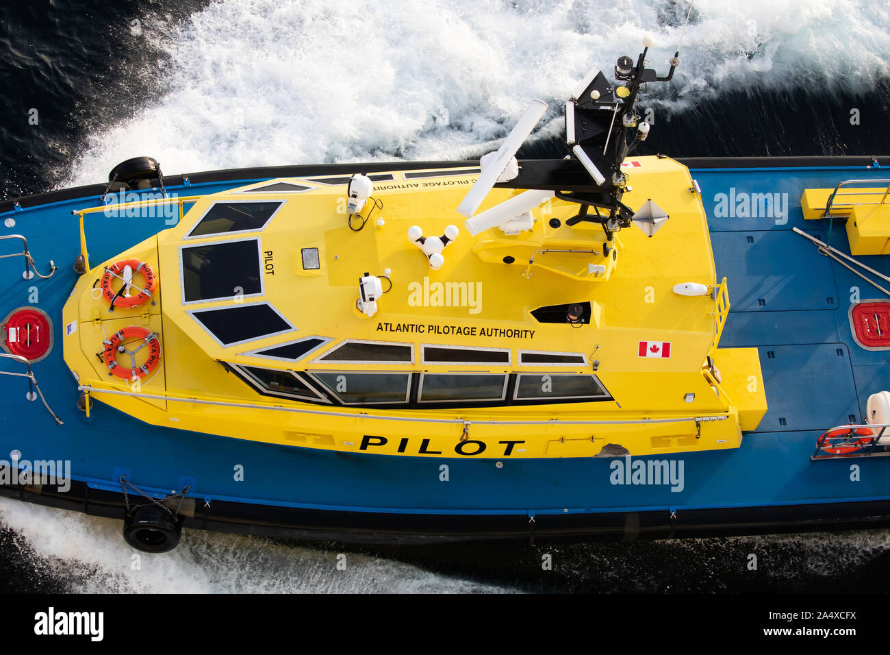 Blue and yellow coloured Pilot Boat on the Atlantic Ocean near Halifax ...