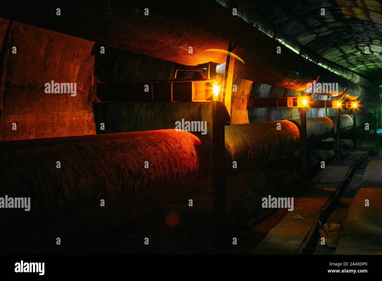 Rusty pipes in tunnel of heating duct system Stock Photo - Alamy